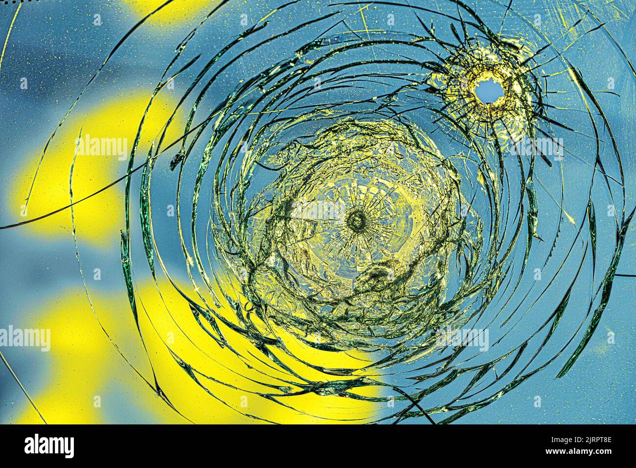 Cracks in the glass from a bullet on the flag of Ukraine Stock Photo ...