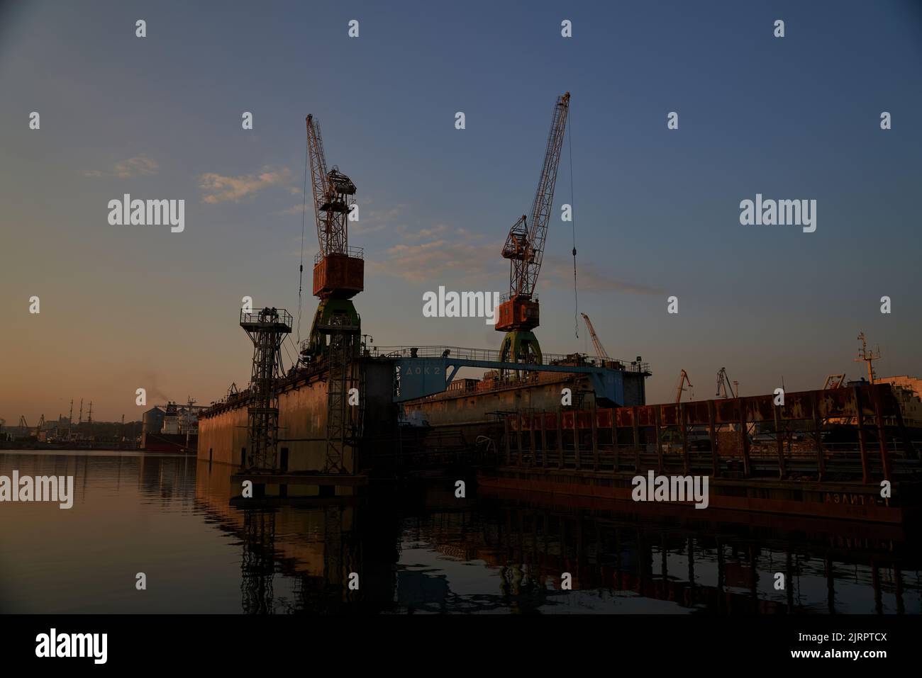 Dry dock with a ship. Old dry dock with a tugboat Stock Photo - Alamy