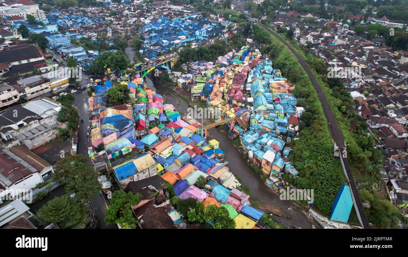 Aerial view of the old slum village Jodipan with colorful houses in Malang city. East Java ...