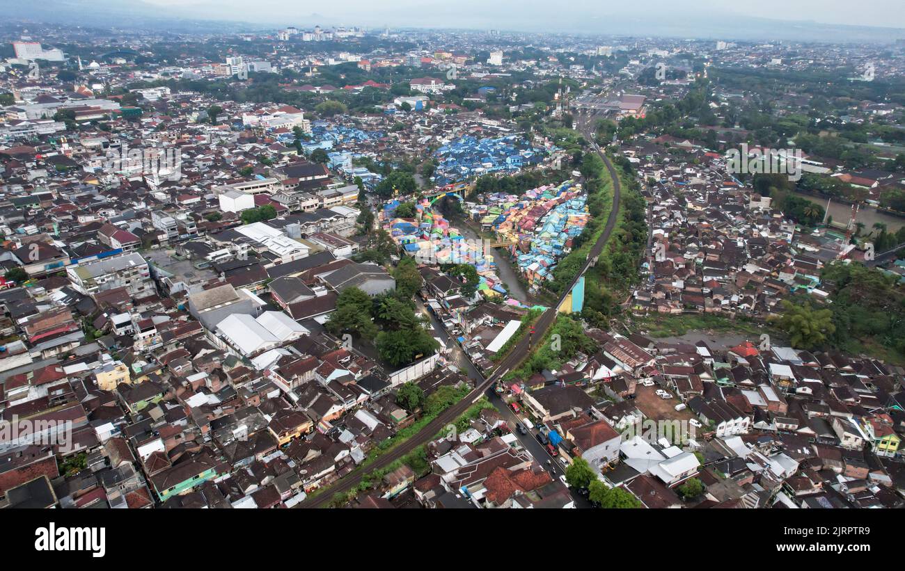 Aerial view of the old slum village Jodipan with colorful houses in Malang city. East Java ...