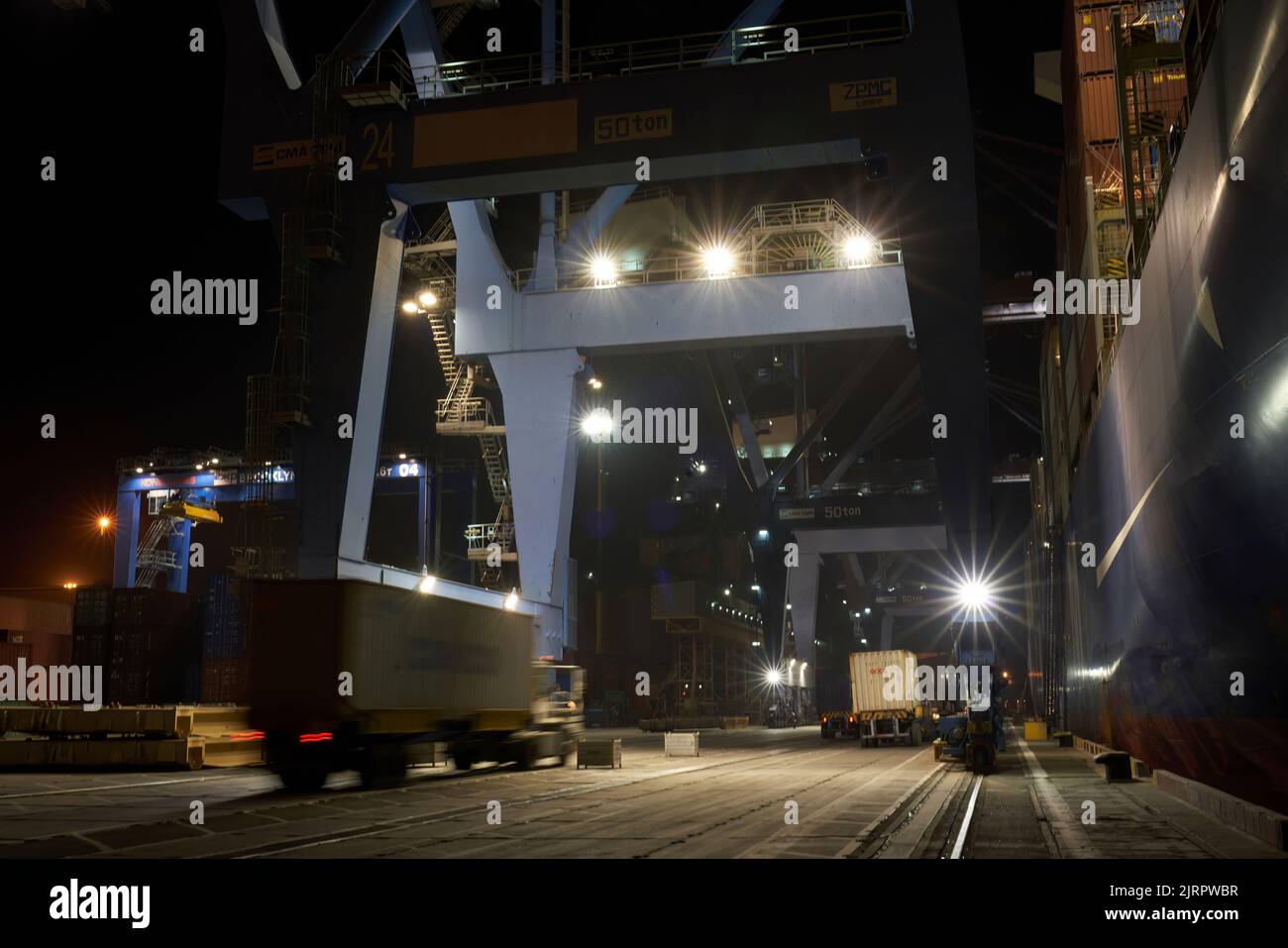 Containers loading by crane in the night , Trade Port. container ...
