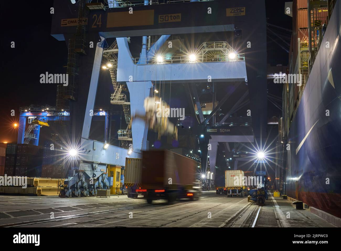 Containers loading by crane in the night , Trade Port. container ...