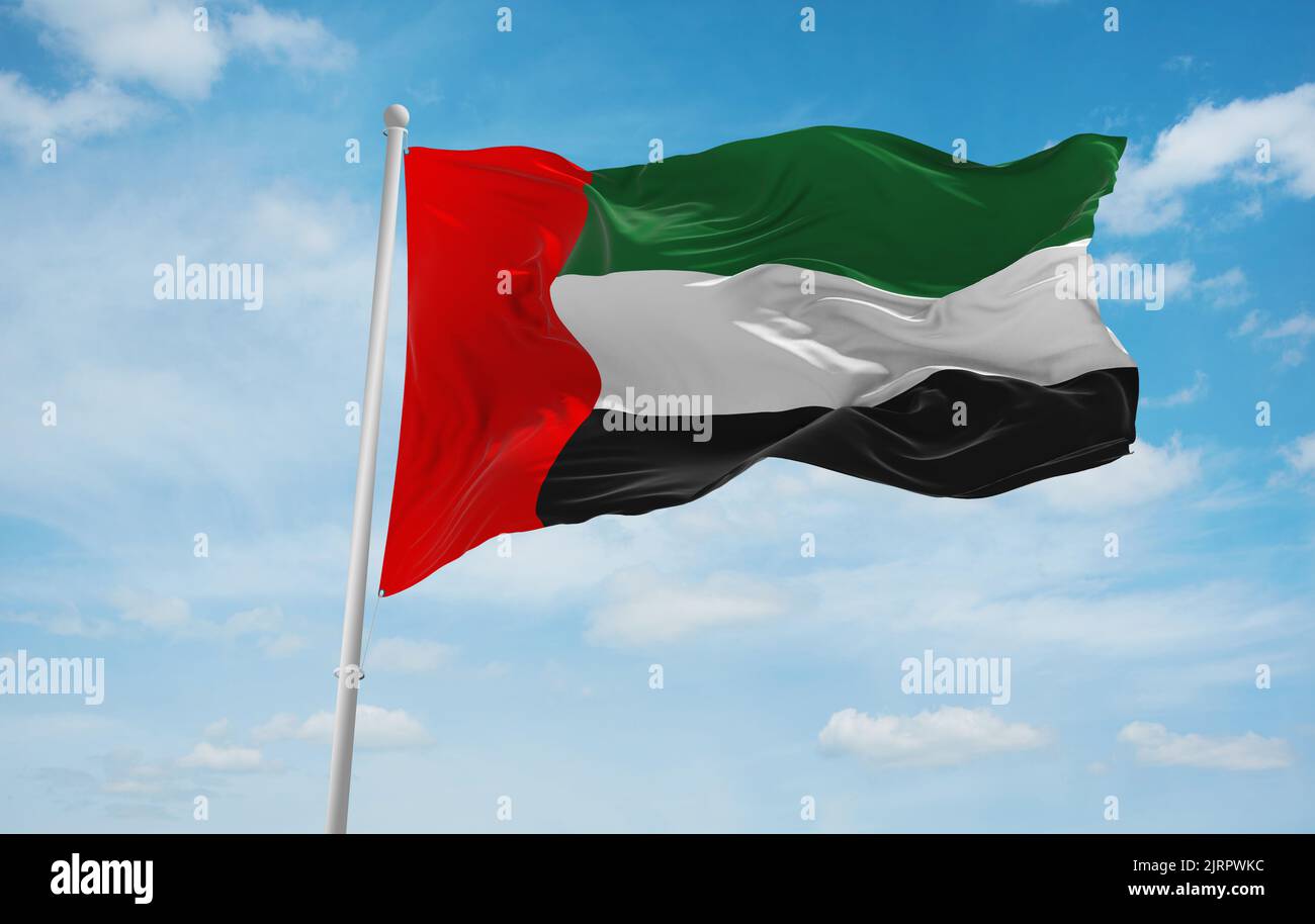 flag of Arab peoples Emiratis at cloudy sky background, panoramic view ...