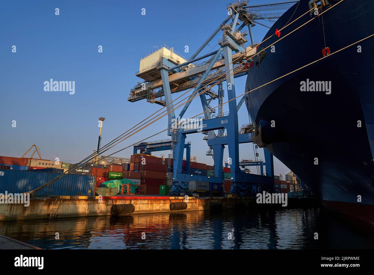 Container ship in port at container terminal. Ships of container ships stand in terminal of port ...