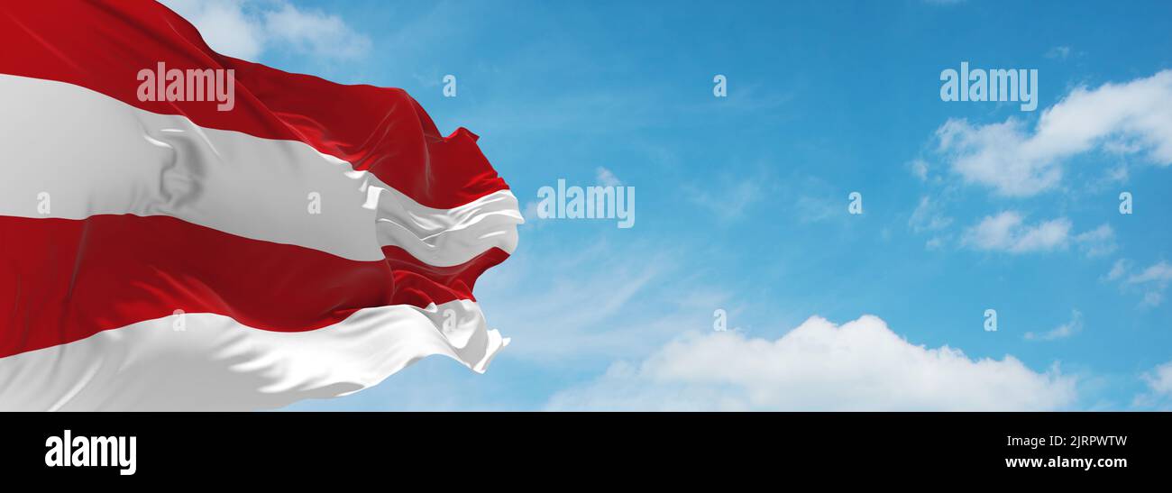 flag of Austronesian peoples Bugis people at cloudy sky background ...