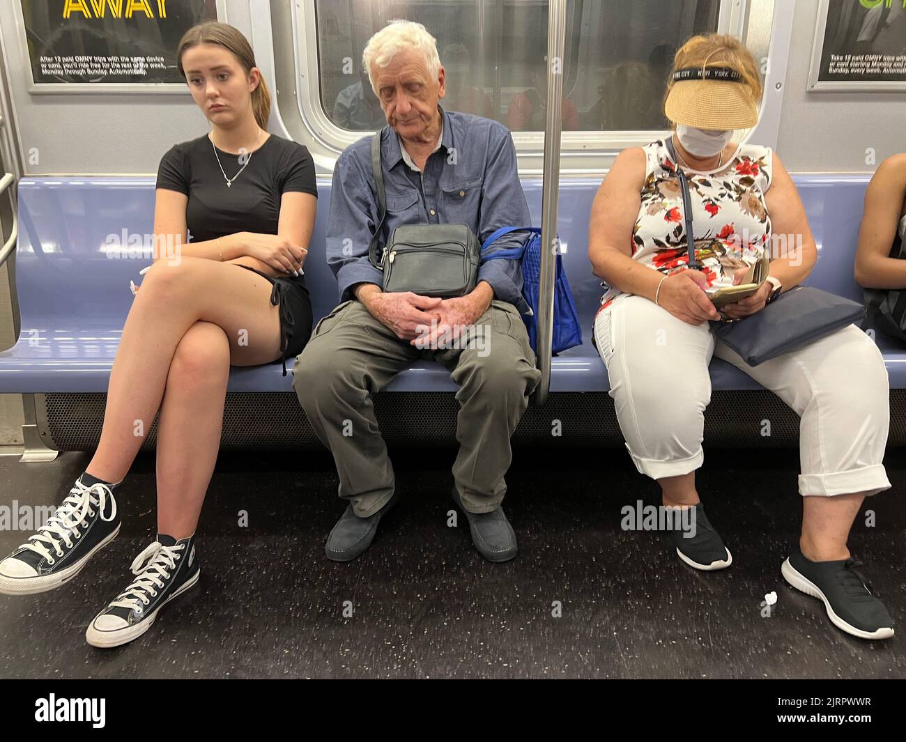 Variety of New York City subway riders during the summer Stock Photo ...