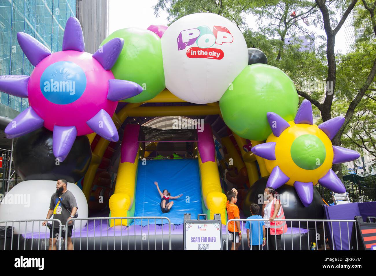 Kids have fun on a fun slide at Greeley Square at Broadway in Manhattan ...