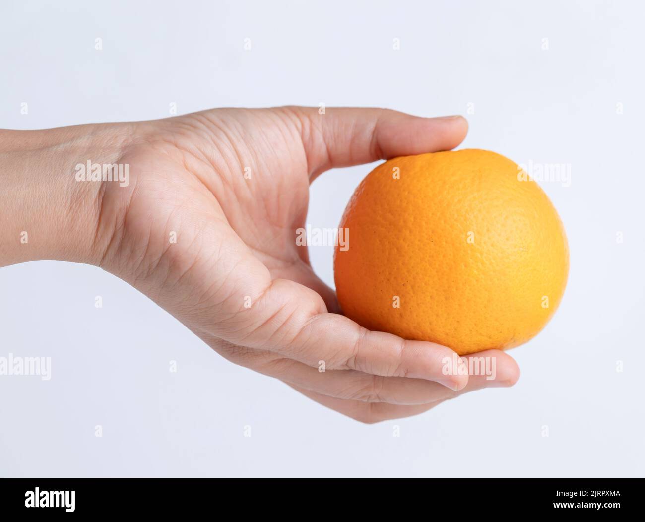 hand holding fresh orange isolated on white backgrounds Stock Photo - Alamy