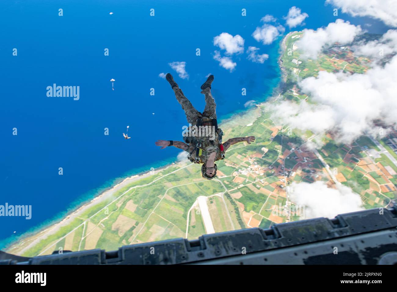 A U.S. Navy sailor jumps out the back of a 1st Special Operations ...