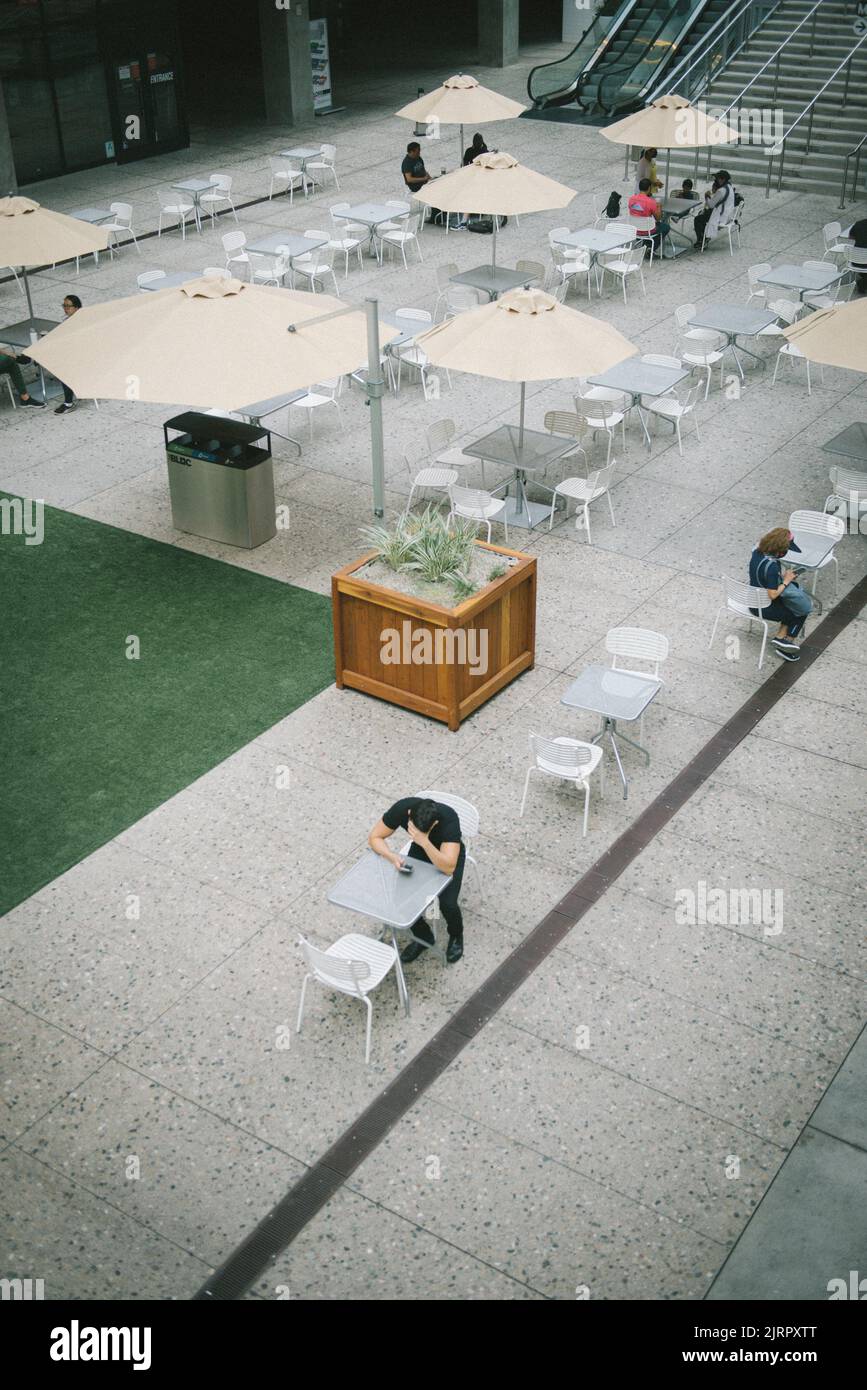 Outdoor open space with tables Stock Photo - Alamy