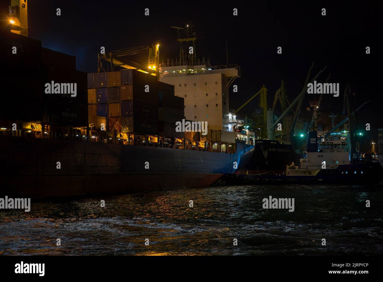 Containers loading by crane in the night , Trade Port. container ...