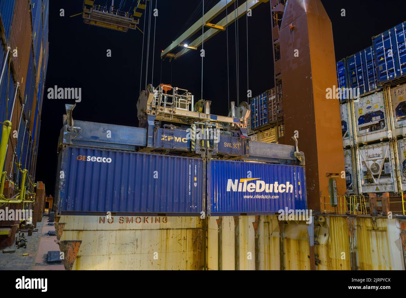 Containers loading by crane in the night , Trade Port. container ...