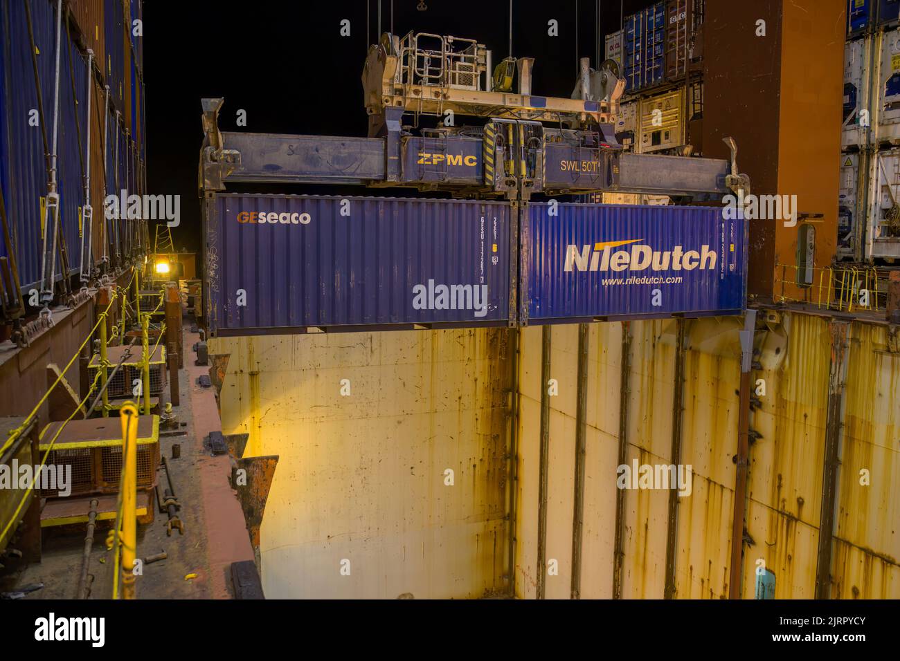 Containers loading by crane in the night , Trade Port. container ...