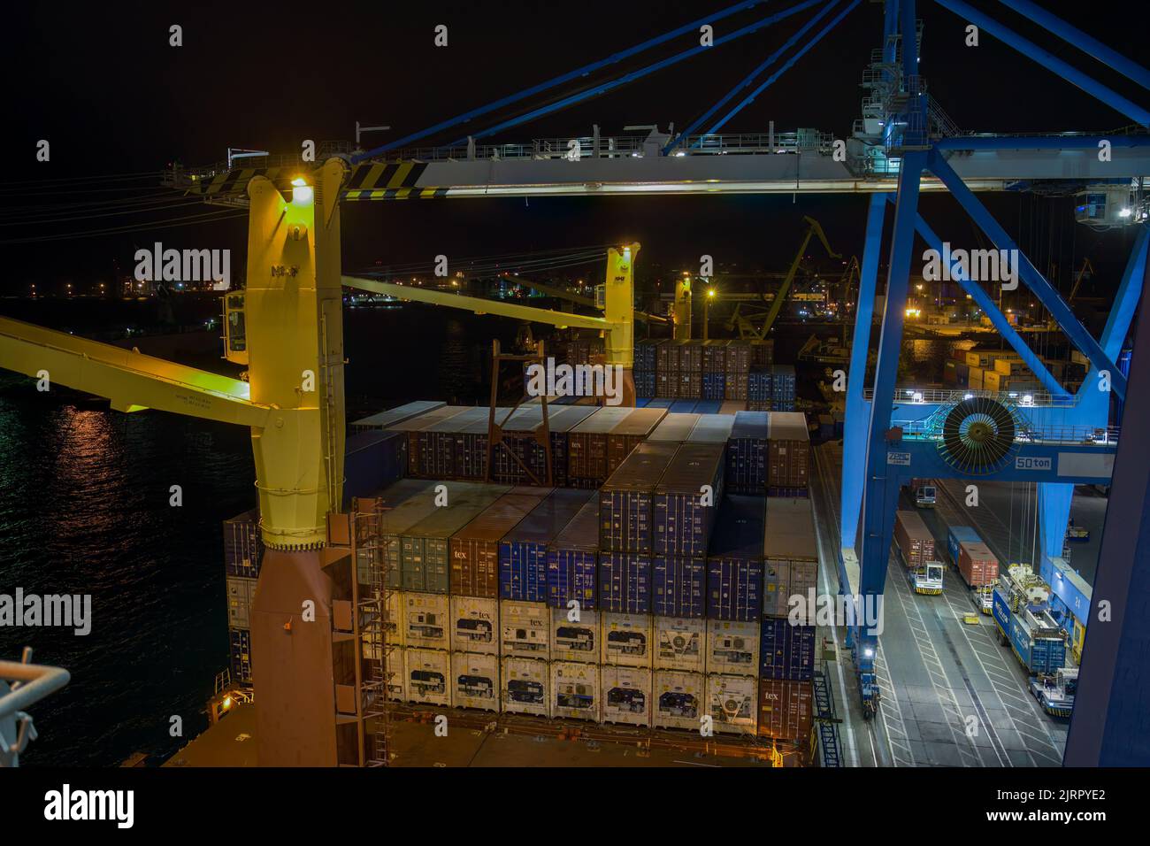 Containers loading by crane in the night , Trade Port. container ...