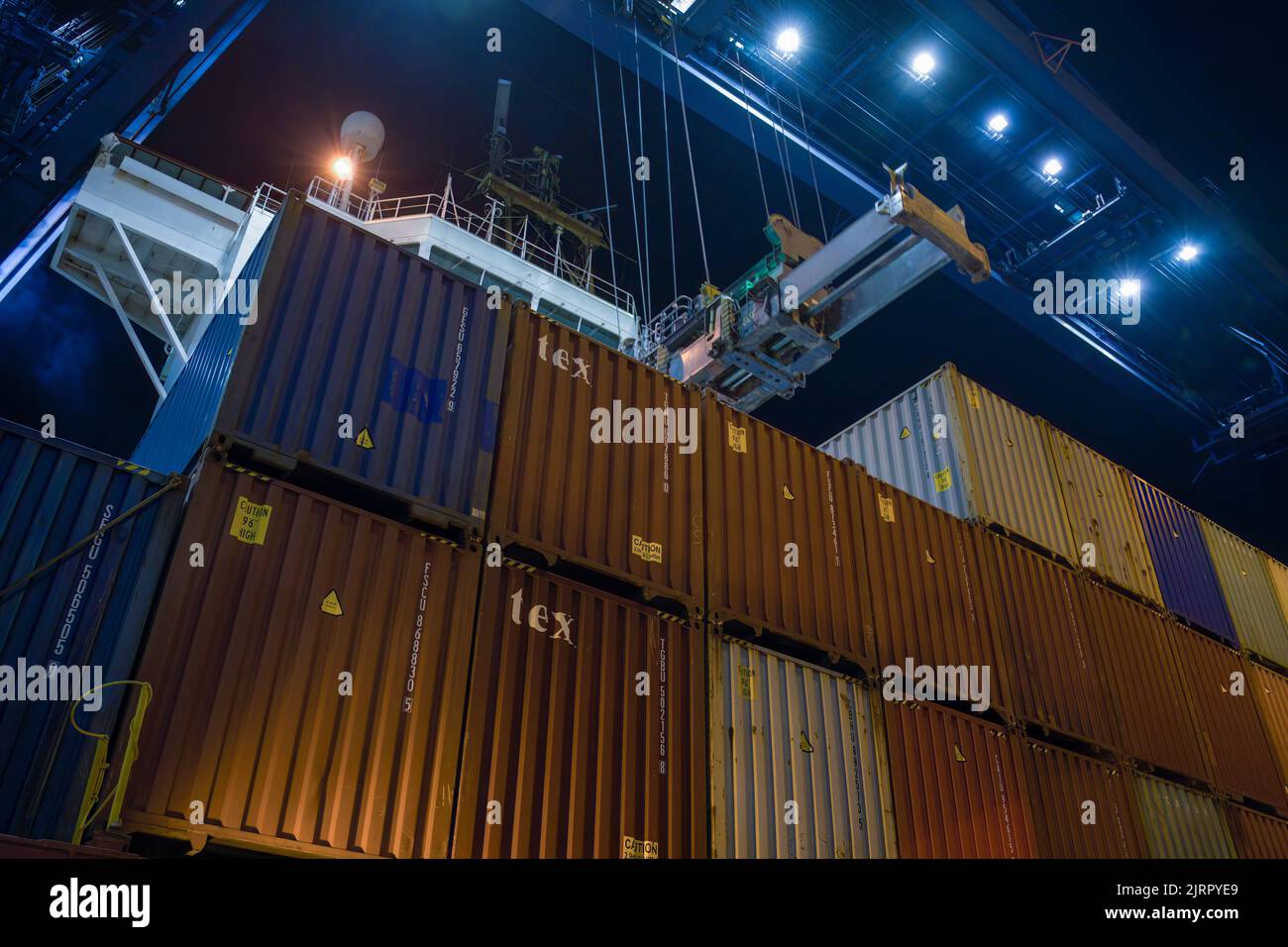 Containers loading by crane in the night , Trade Port. container ...