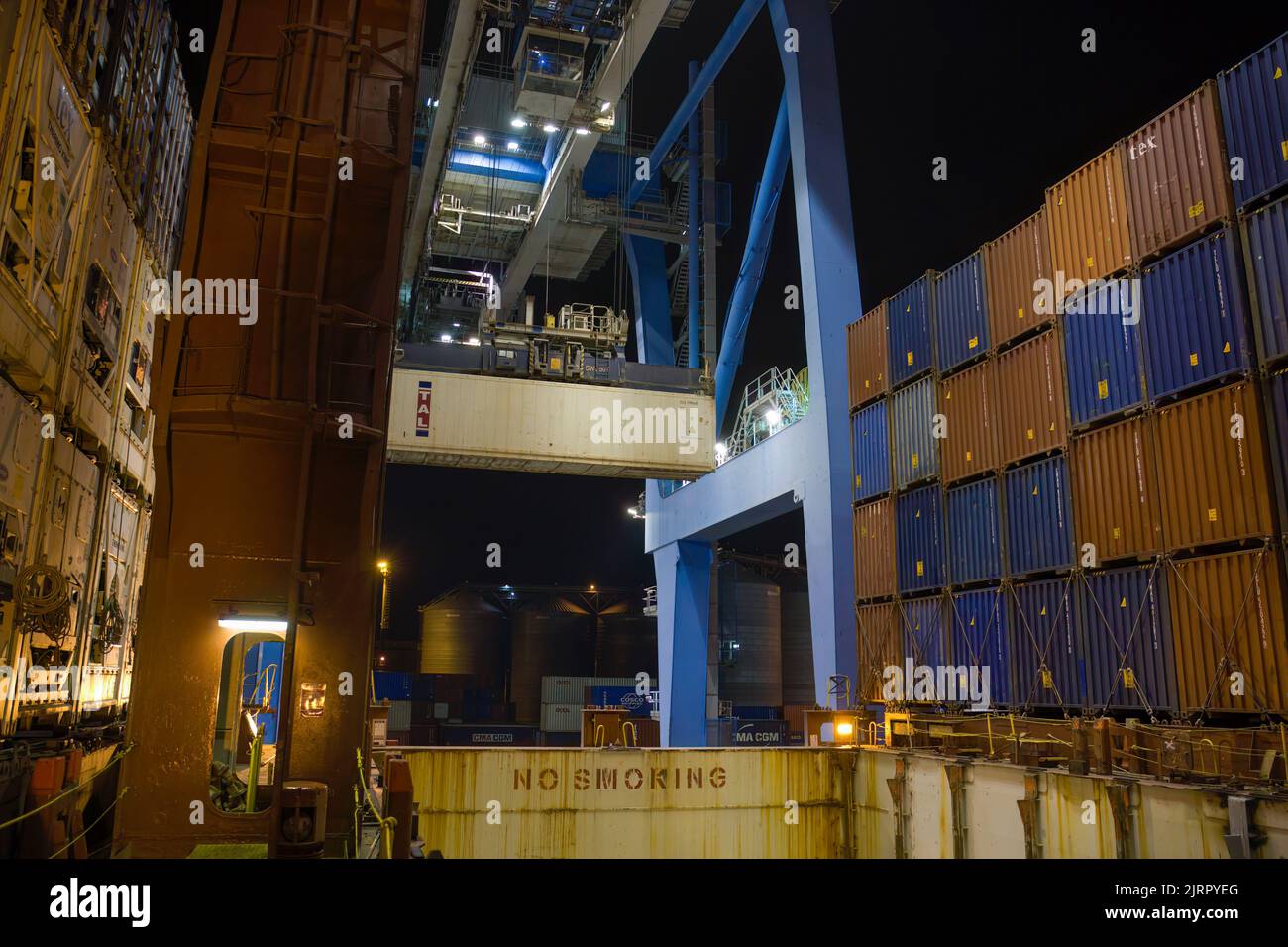 Containers loading by crane in the night , Trade Port. container ...