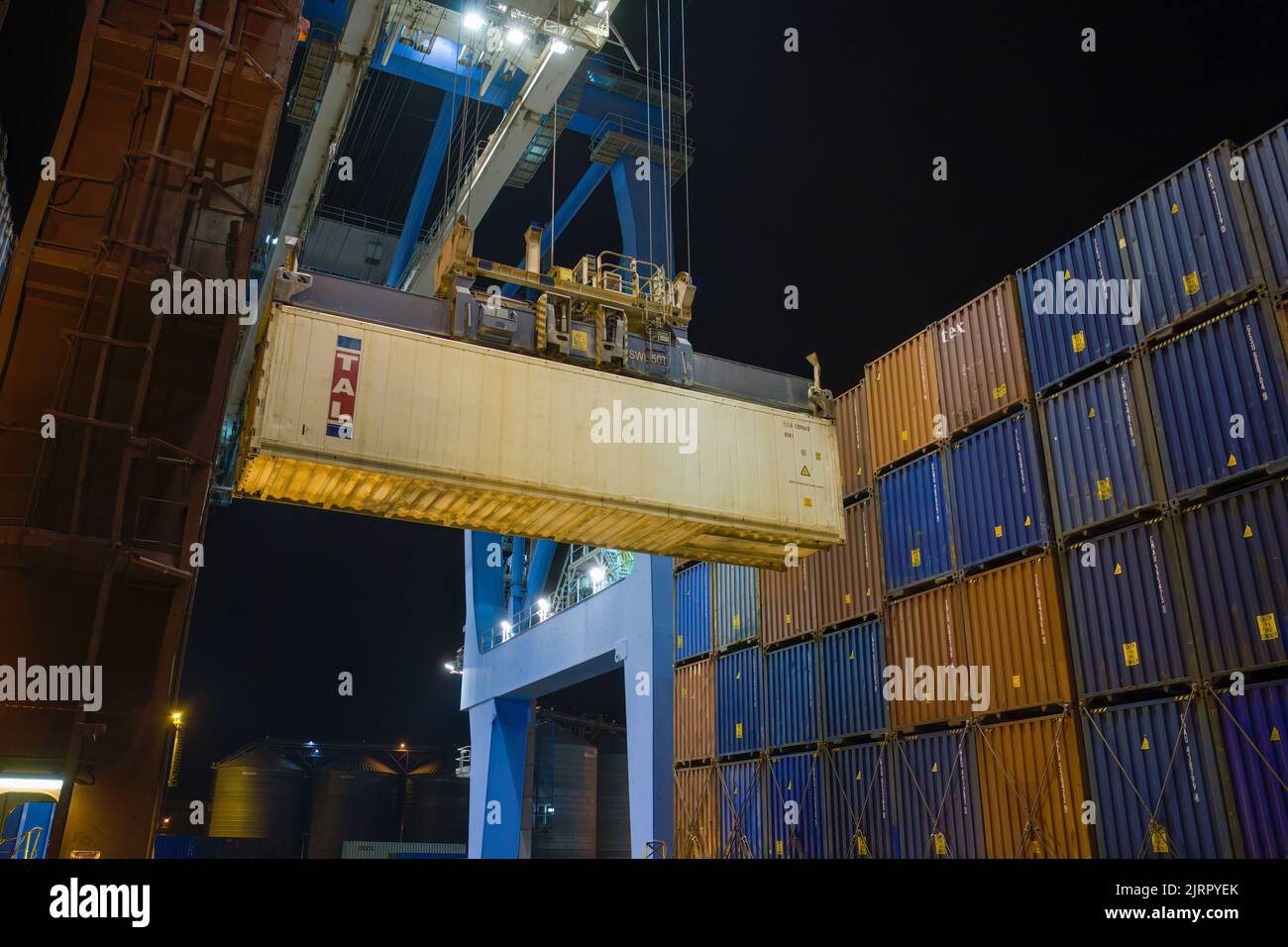 Containers loading by crane in the night , Trade Port. container ...