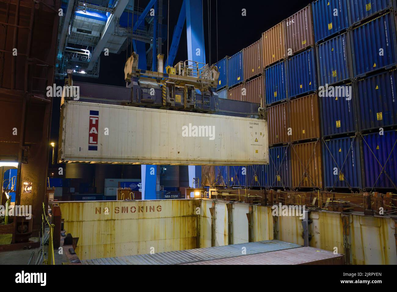 Containers loading by crane in the night , Trade Port. container ...