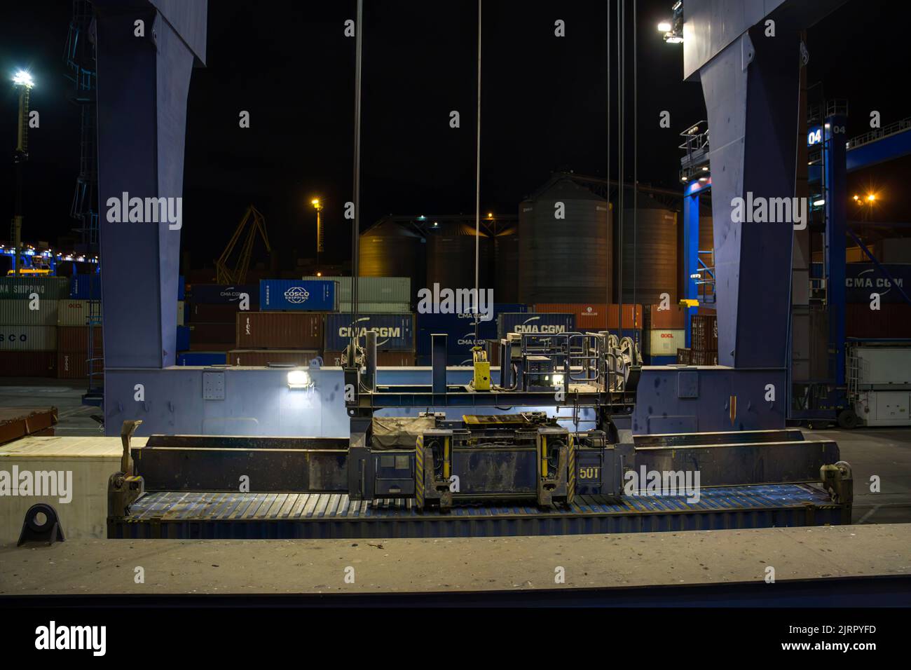 Containers loading by crane in the night , Trade Port. container ...