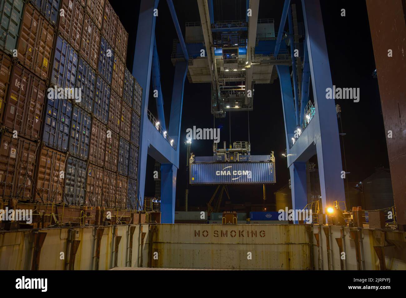 Containers loading by crane in the night , Trade Port. container ...