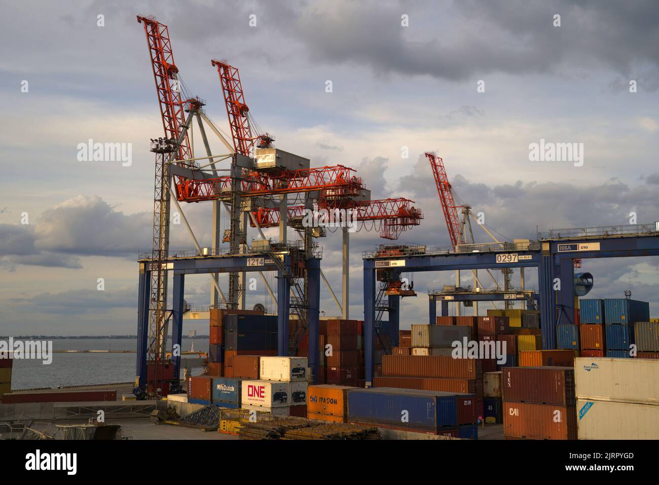 Industrial port with containers and cranes Stock Photo - Alamy