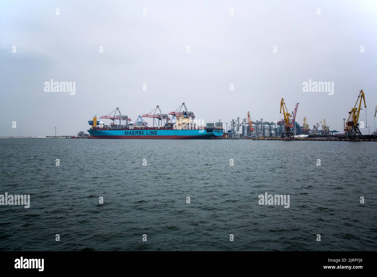 Container ship MAERSK in port at container terminal. Ships of container ...