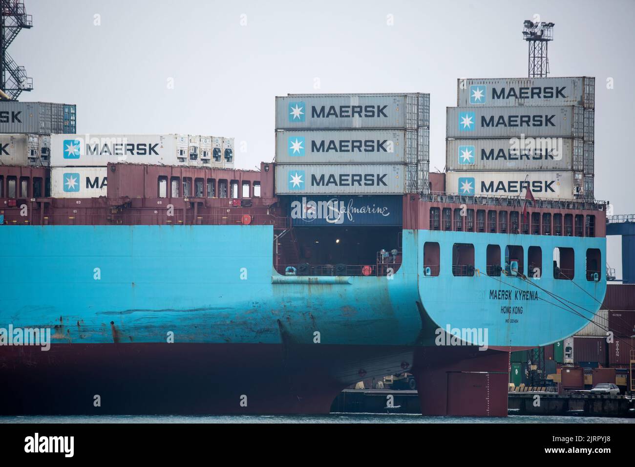 Container ship MAERSK in port at container terminal. Ships of container ...