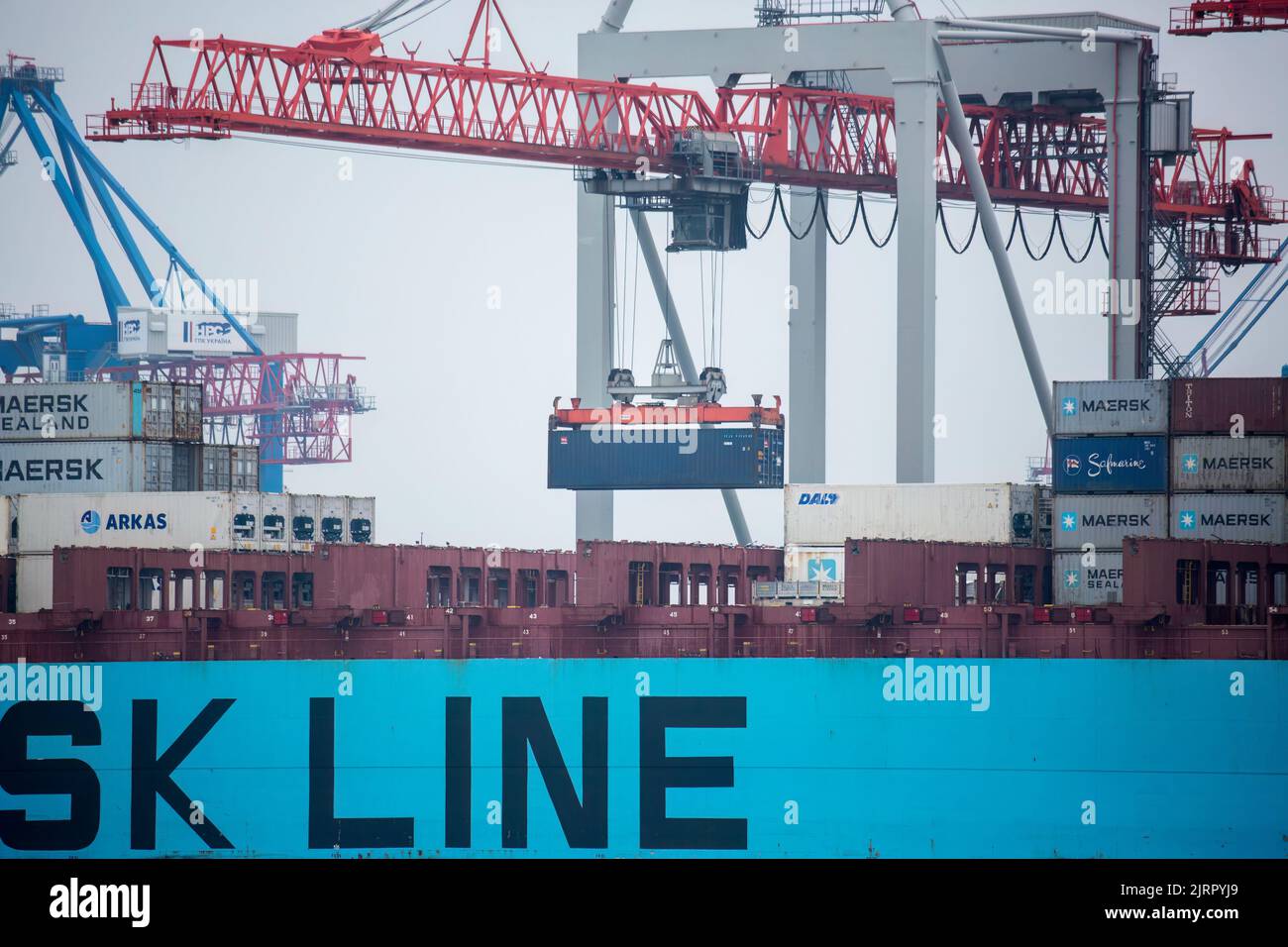 Container ship MAERSK in port at container terminal. Ships of container ...