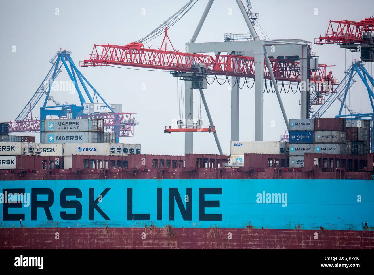 Container ship MAERSK in port at container terminal. Ships of container ...