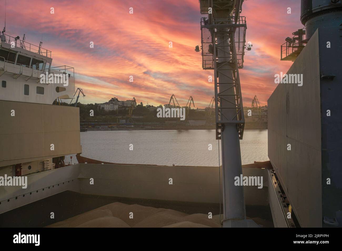 loading corn onto a bulk carrier ship in the port at the grain terminal ...