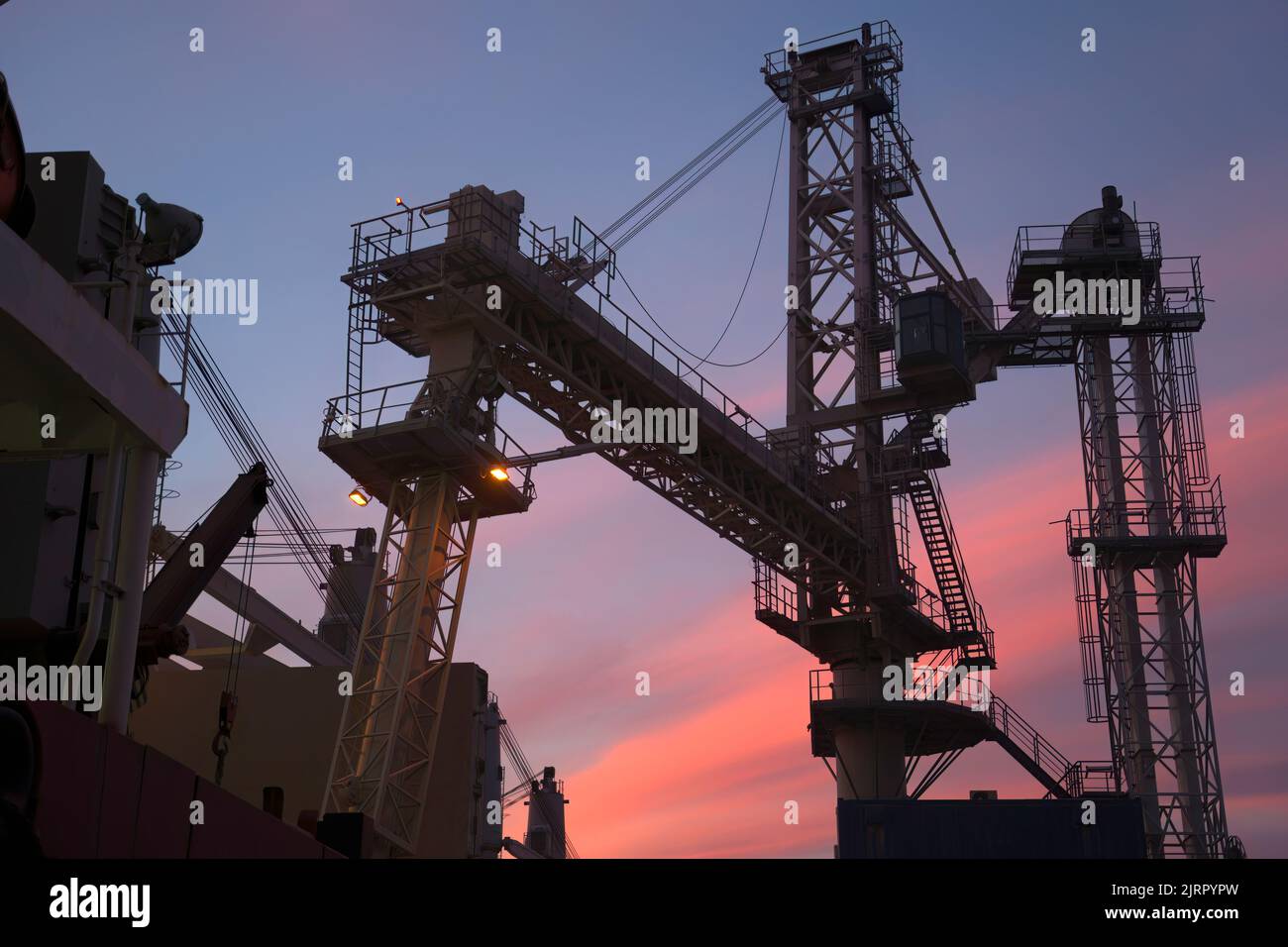 Bulk carrier at port grain elevator. Panamax bulk carrier loaded with ...