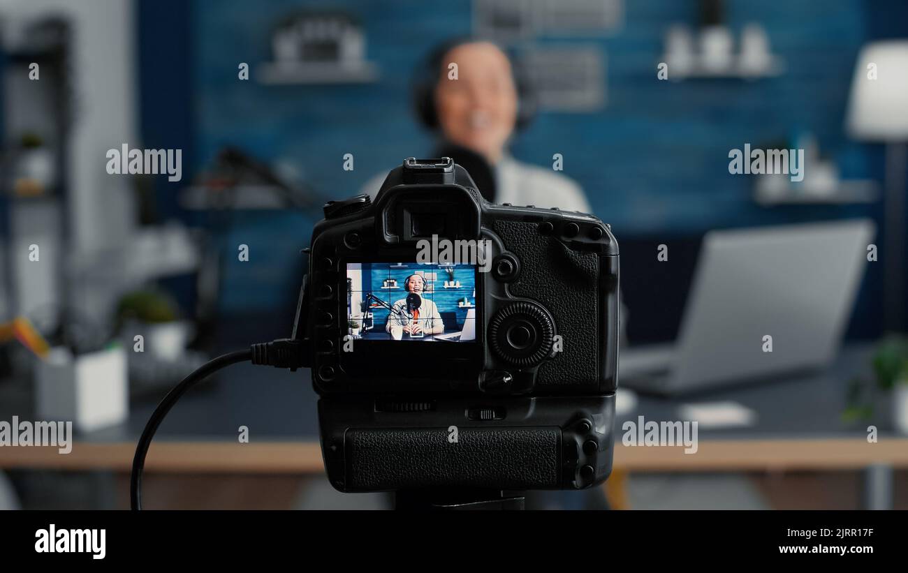 Professional modern camera recording internet star talking to audience ...