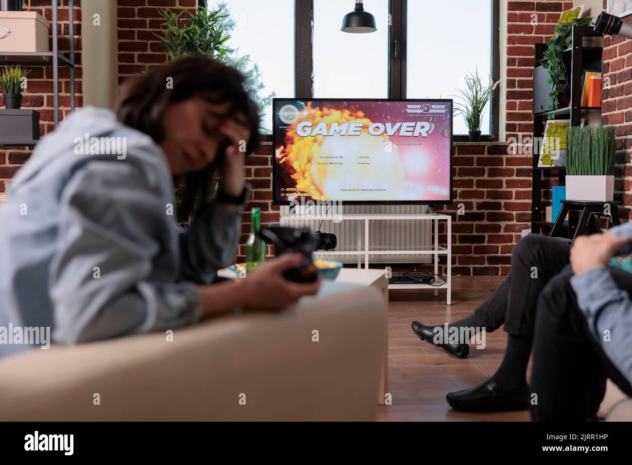 Competitive woman losing after playing shooter video games, feeling ... Competitive woman losing after playing shooter video games, feeling ...