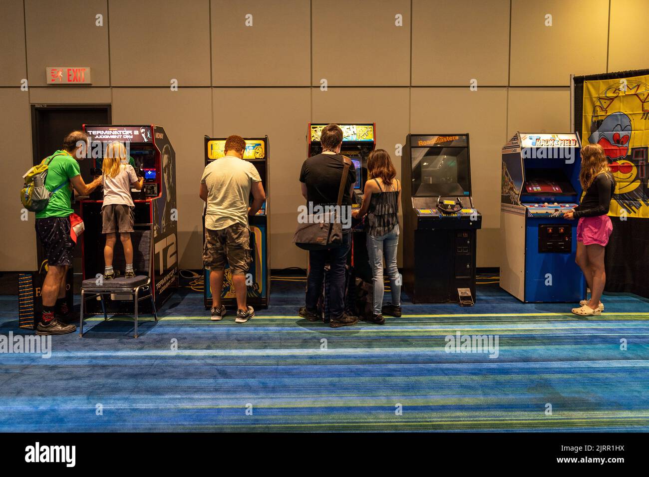 People play arcade games at Fan Expo Canada in Toronto on Aug. 25, 2022 ...