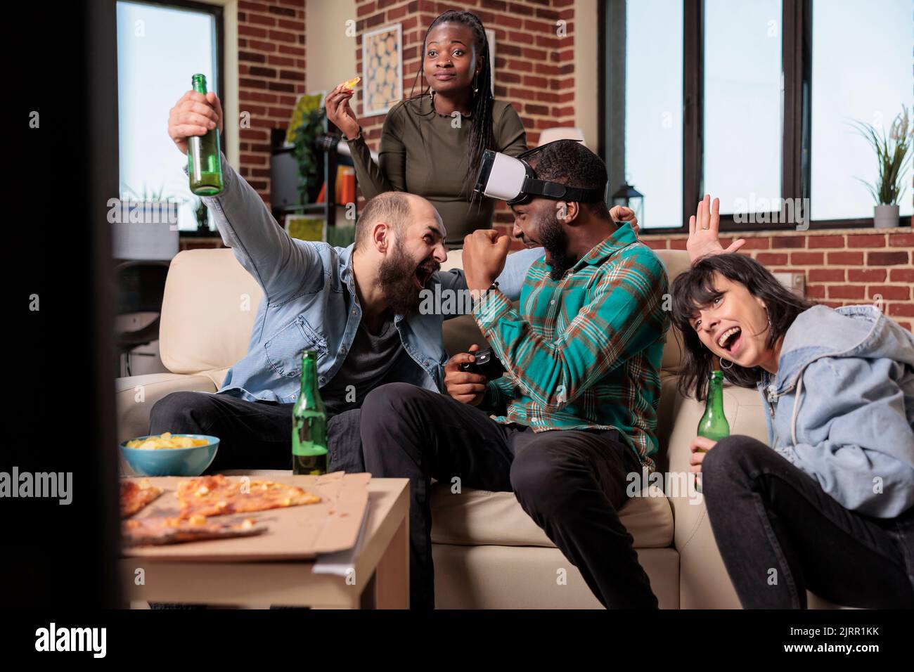 Group of people celebrating video games victory on tv console, playing ...