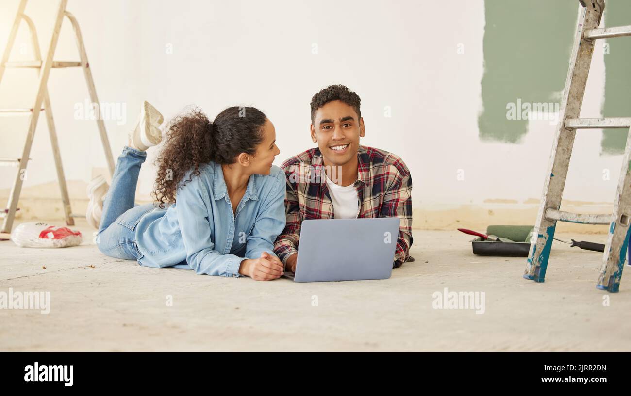 Couple relax with laptop, living room home renovation and interior ...