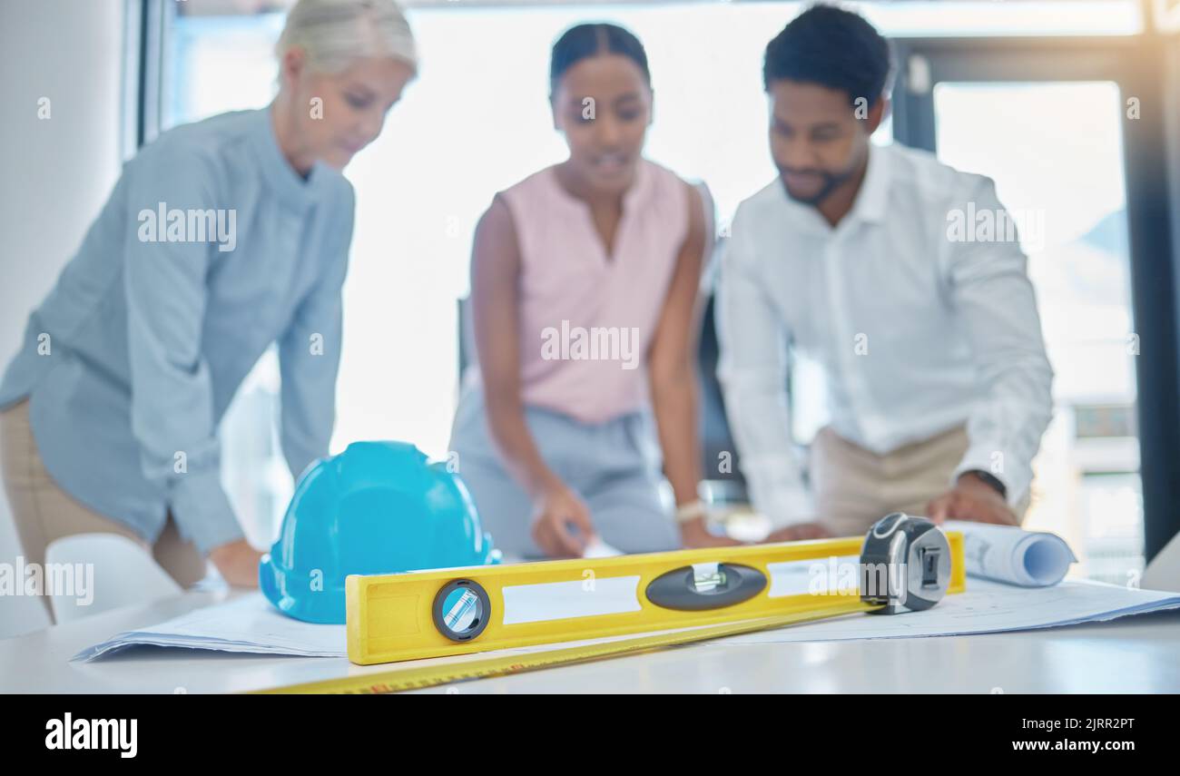 Team of engineering designer planning a building strategy in an office ...