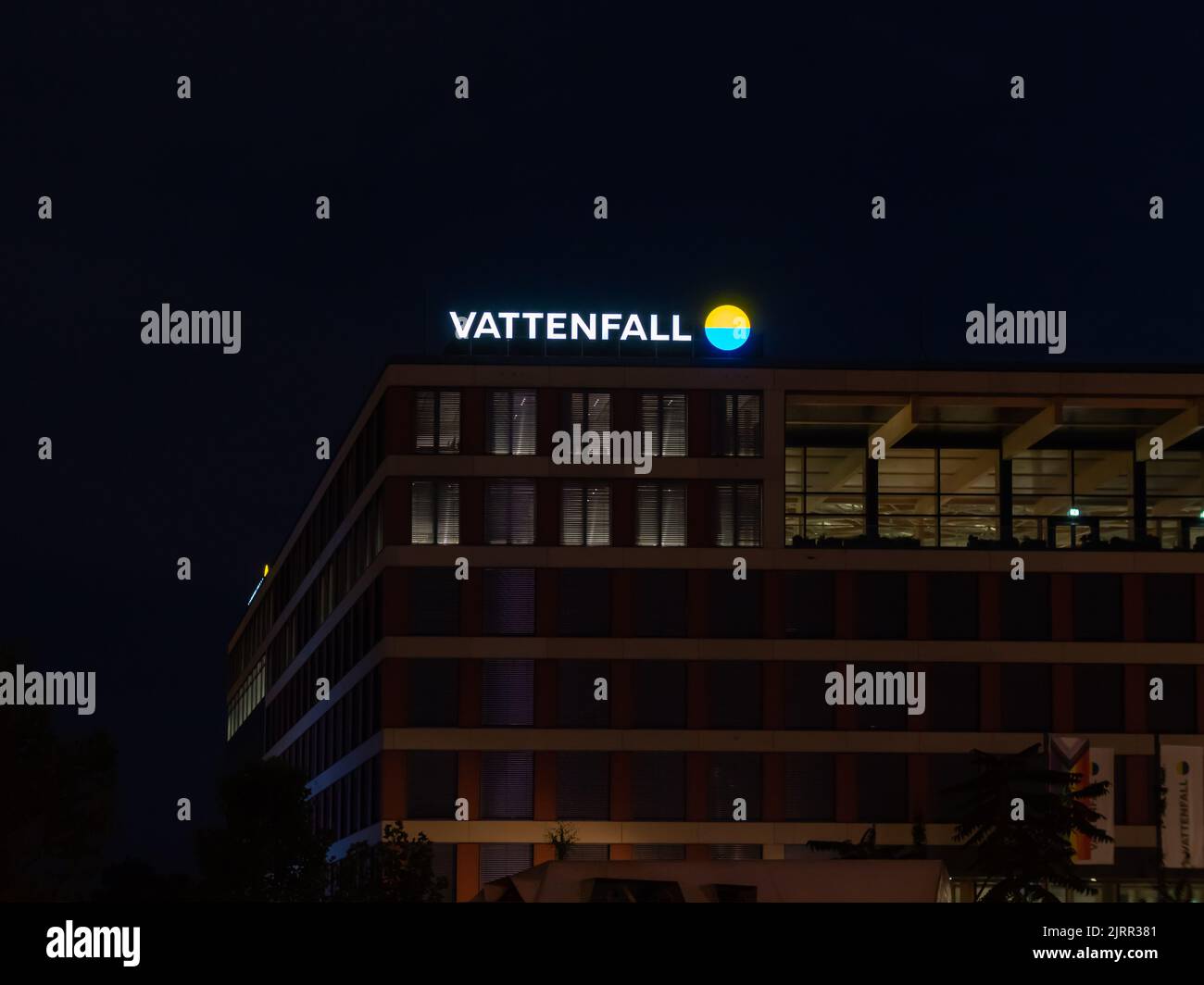 Vattenfall logo illuminated on an office house at night. Bright glowing ...