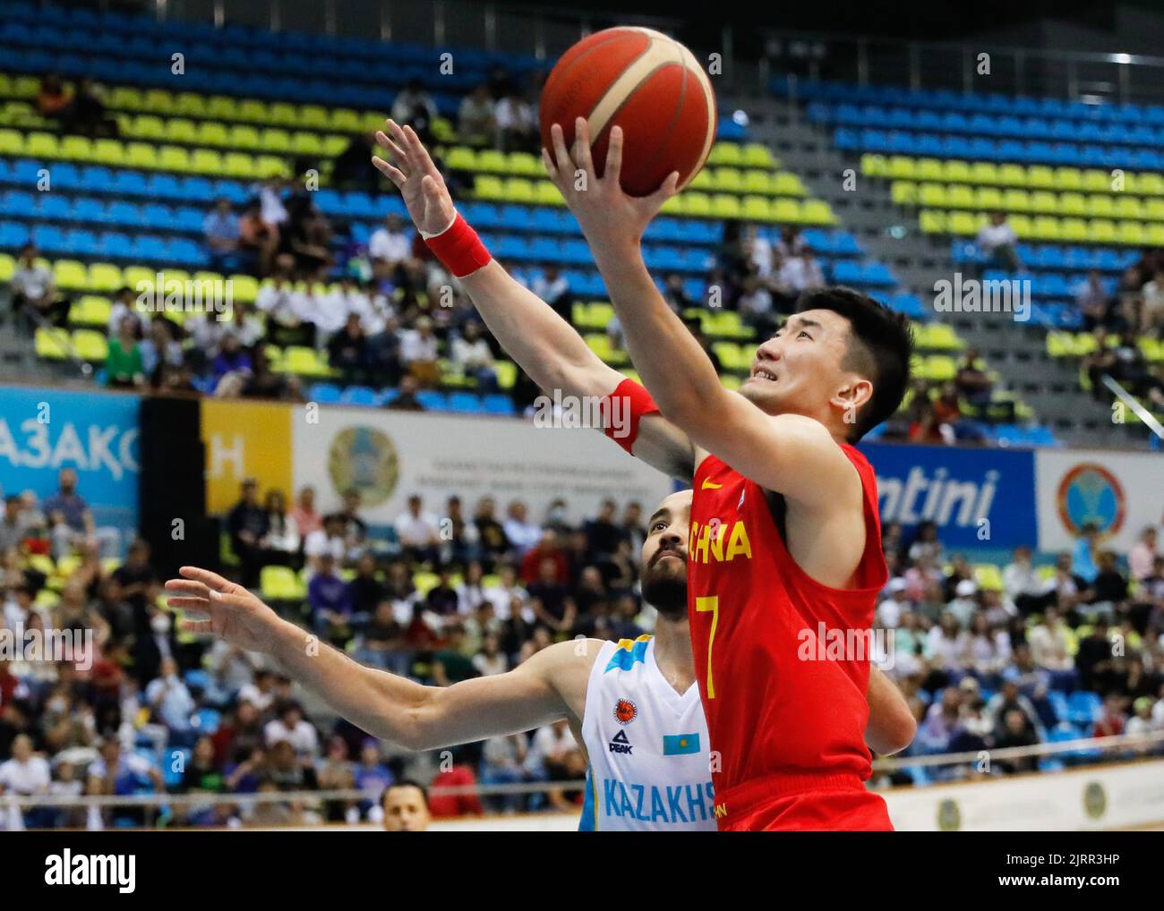 Nur Sultan. 26th Aug, 2022. Sun Minghui (R) of China goes for a basket ...