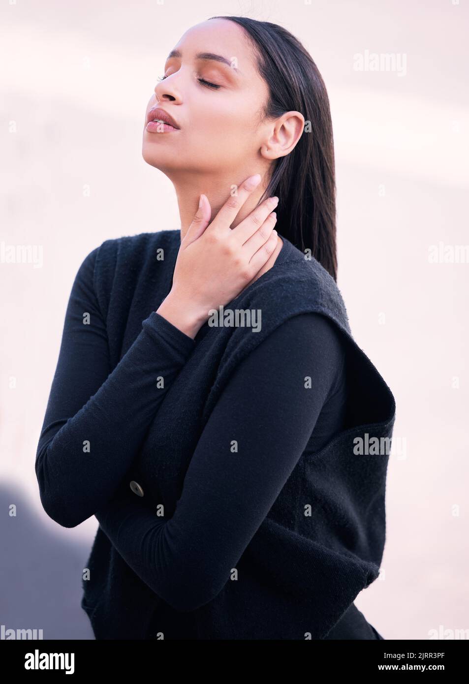 Portrait, woman and hands of an attractive female touching her neck in ...