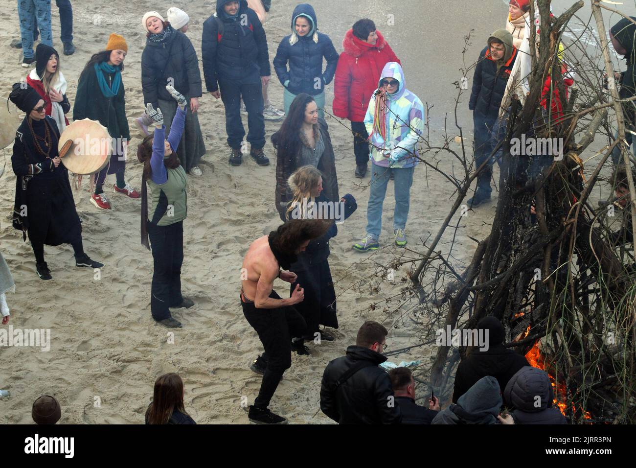 People are seen dancing around the fire. Maslenitsa (also known as ...