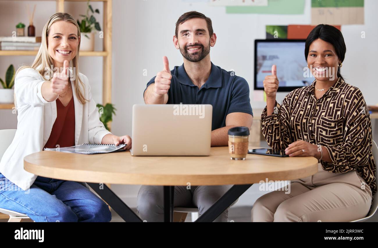 Teamwork, diversity and a thumbs up from a group of happy business ...