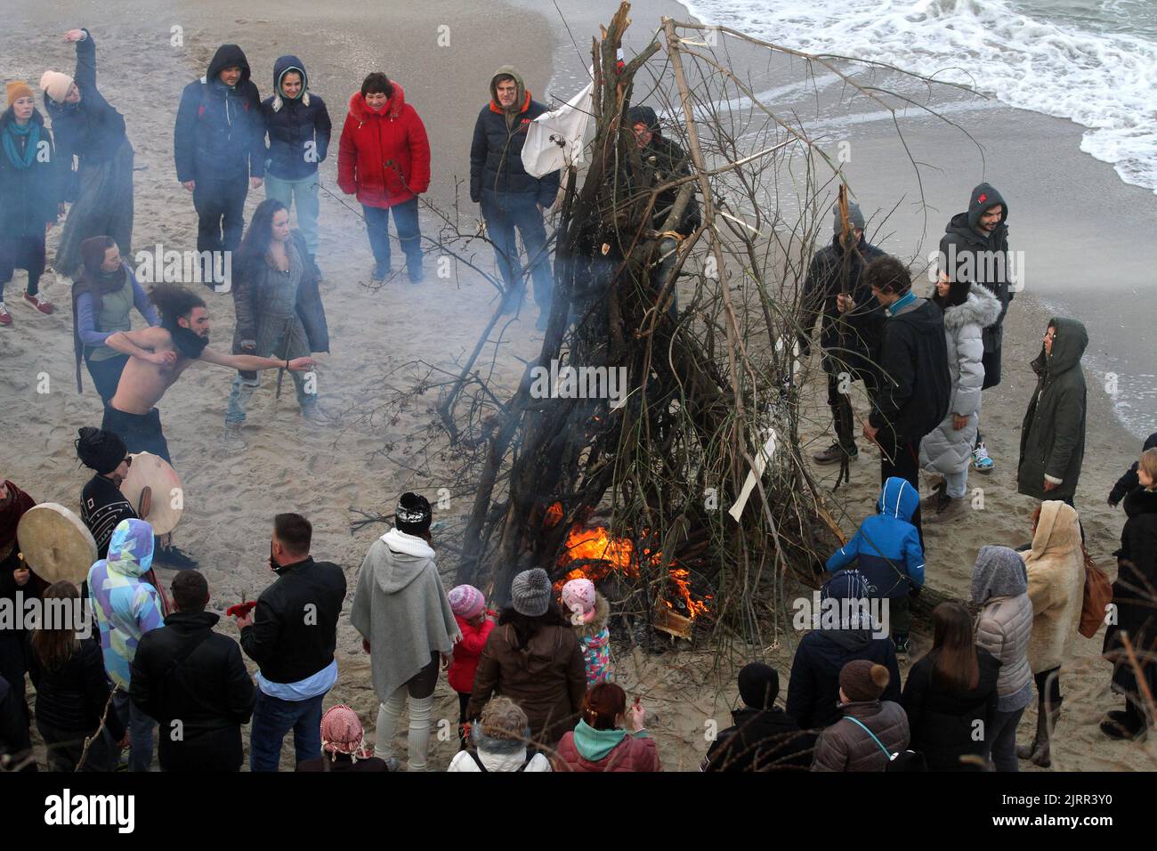 People are seen dancing around the fire. Maslenitsa (also known as ...