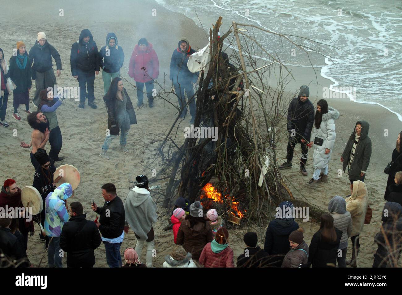 People are seen dancing around the fire. Maslenitsa (also known as ...