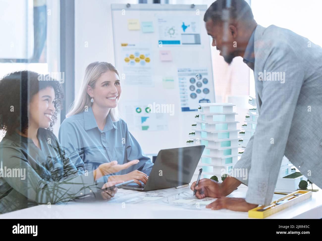 Architect teamwork, building engineer or designer on laptop talking ...