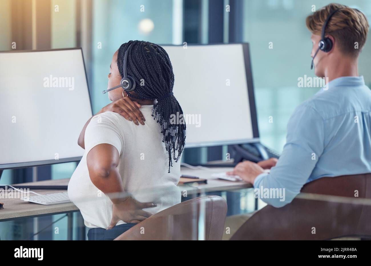 Pain, injury and muscle with a woman call center agent or support staff ...
