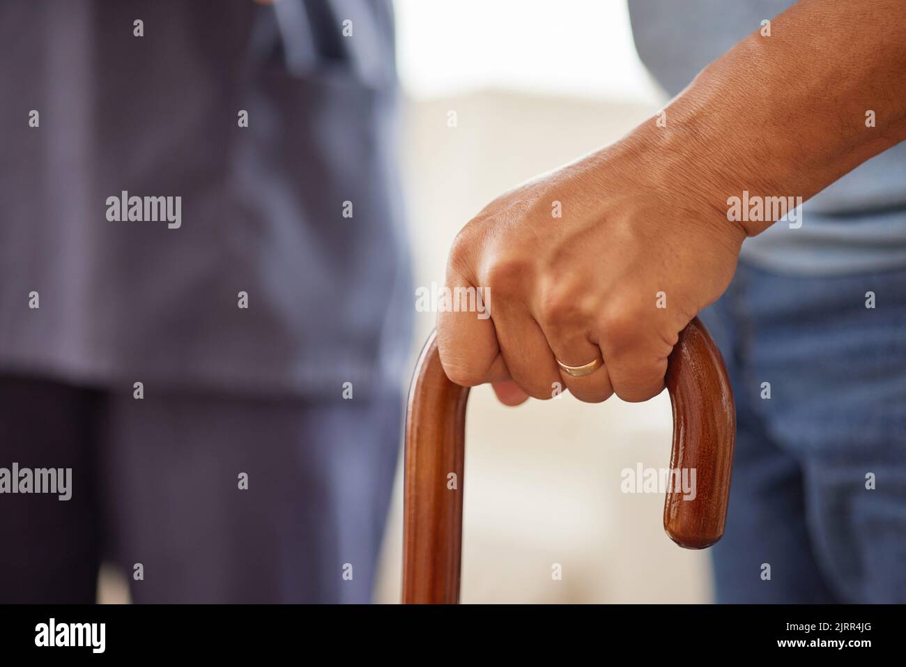 Support, physiotherapy and disability patient hold walking stick or ...