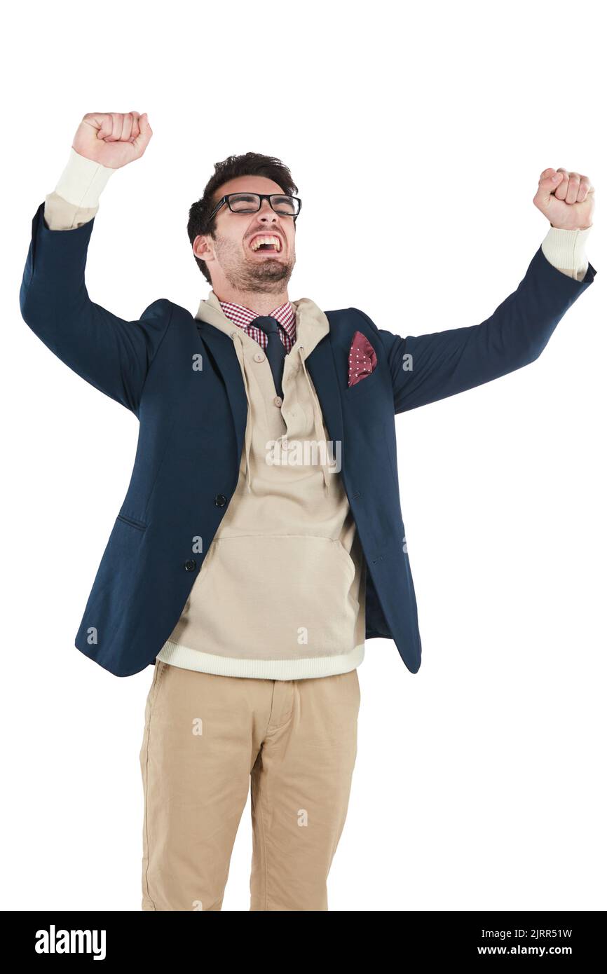 I did it. Studio shot of a young man cheering with his arms raised ...