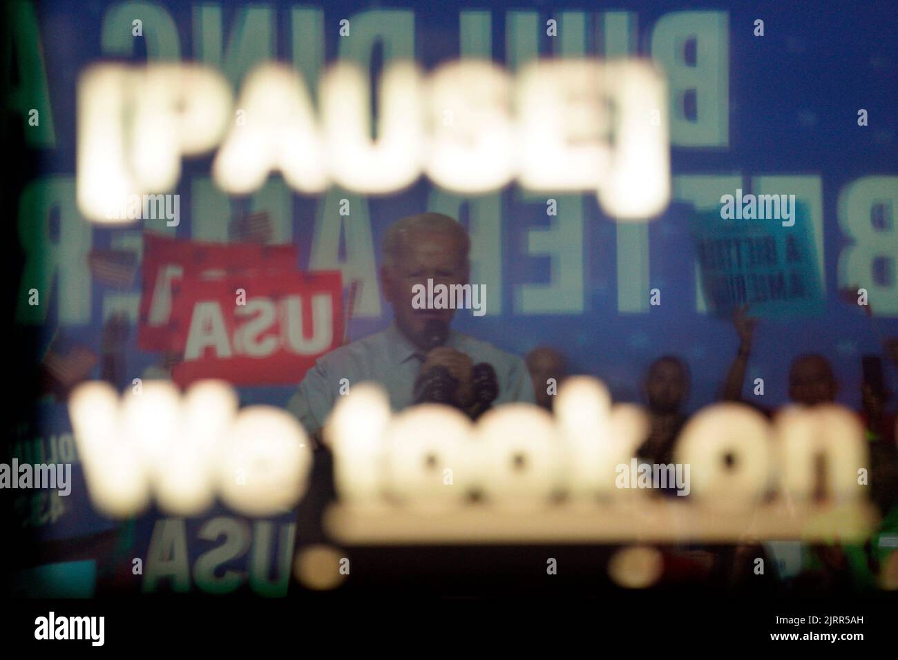US President Joe Biden is reflected in a teleprompter at a rally for ...