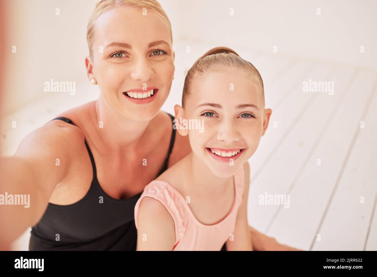 Family, dance and ballet with a mother and her young daughter taking a ...